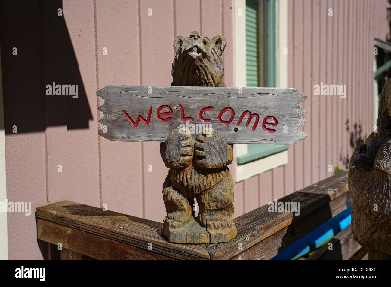 Wooden bear statue in Creek Street, Ketchikan, a popular tourist area ...