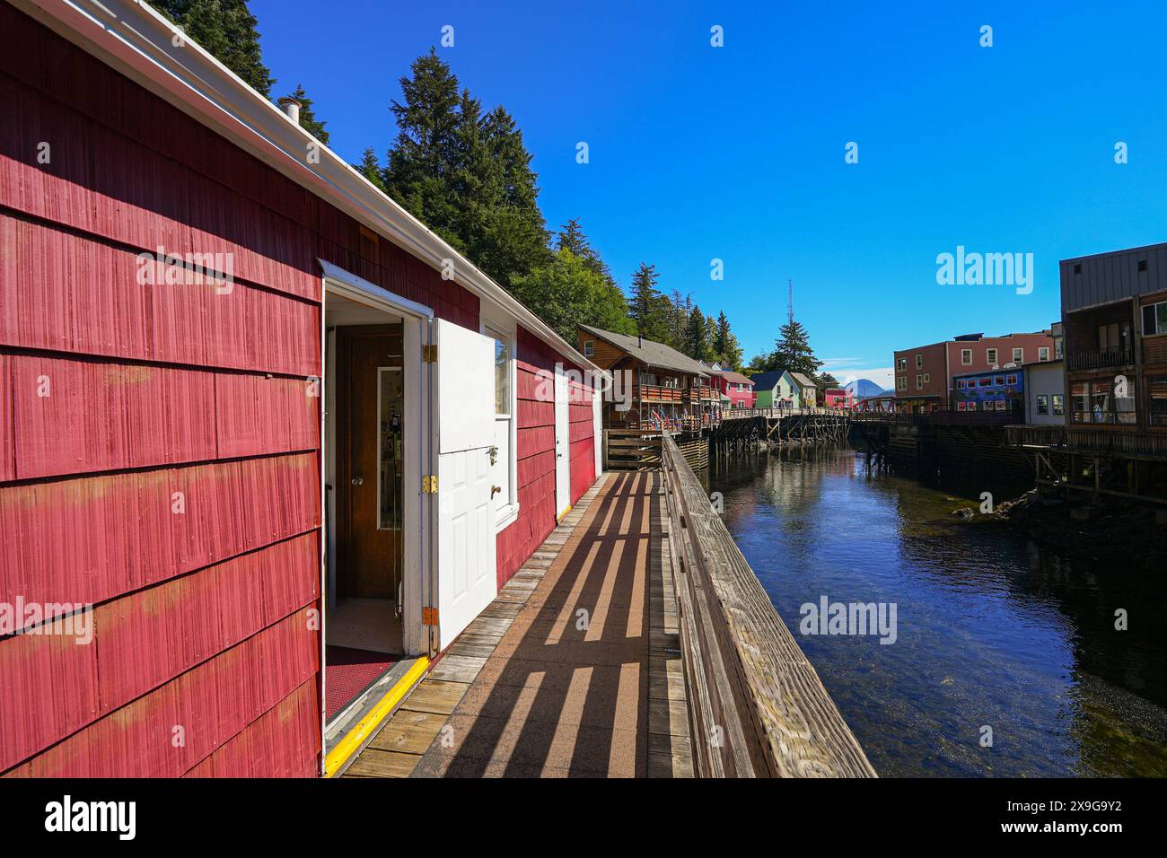Historic wooden buildings of Creek Street in Ketchikan, built on a ...
