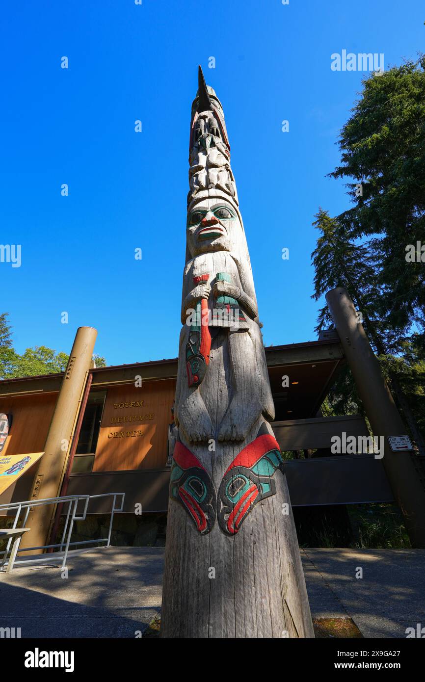 Wooden painted totem pole in front of the Totem Heritage Center in ...