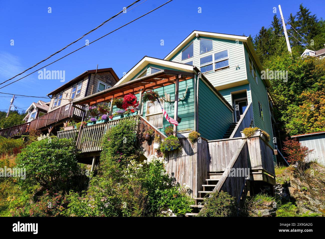 Historic wooden house built on a slope in the Alaskan mountains in ...