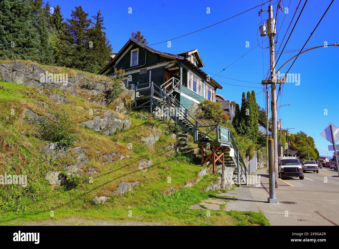 Historic wooden houses built on a slope in the Alaskan mountains in ...