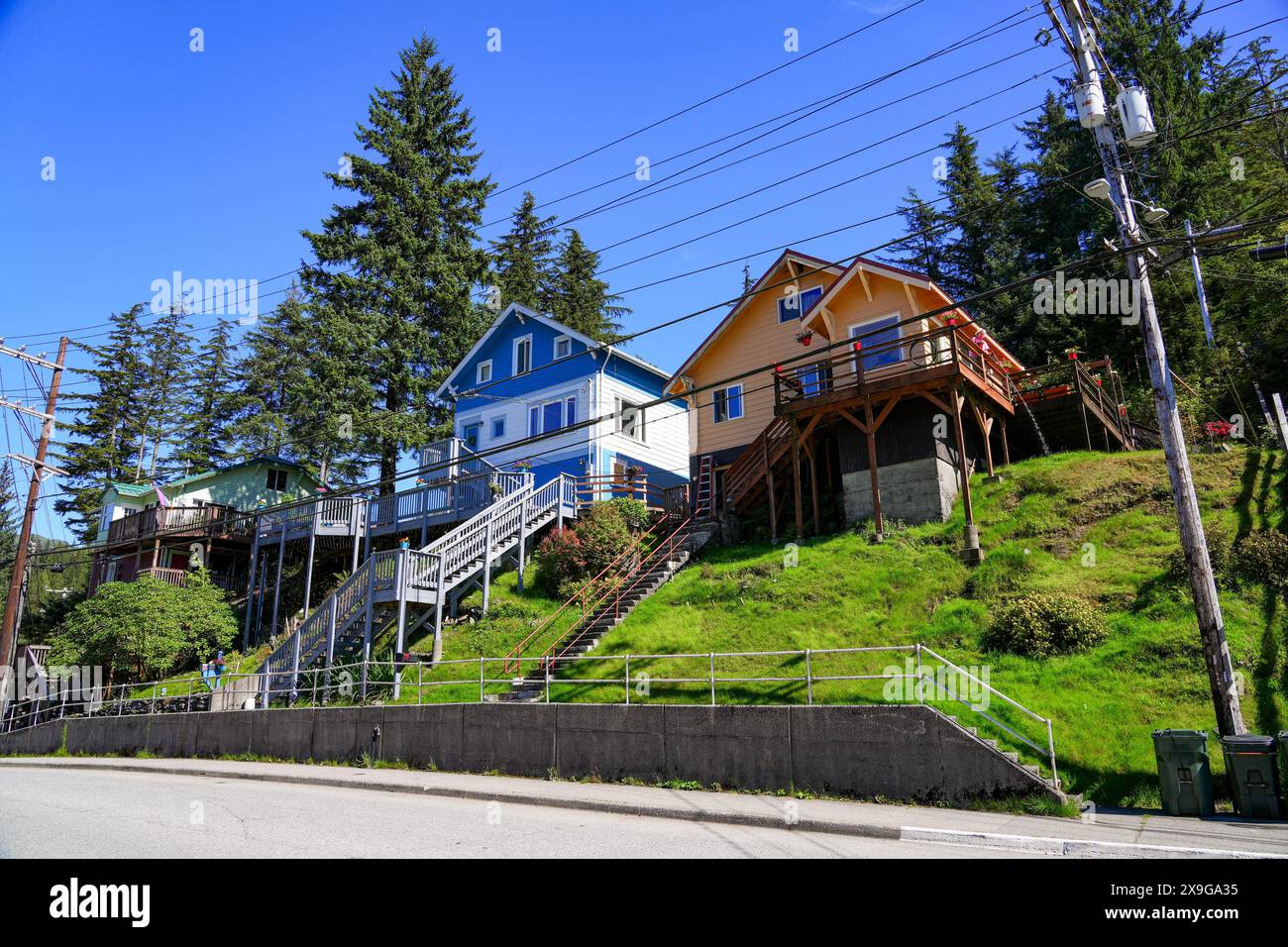Historic wooden houses built on a slope in the Alaskan mountains in ...