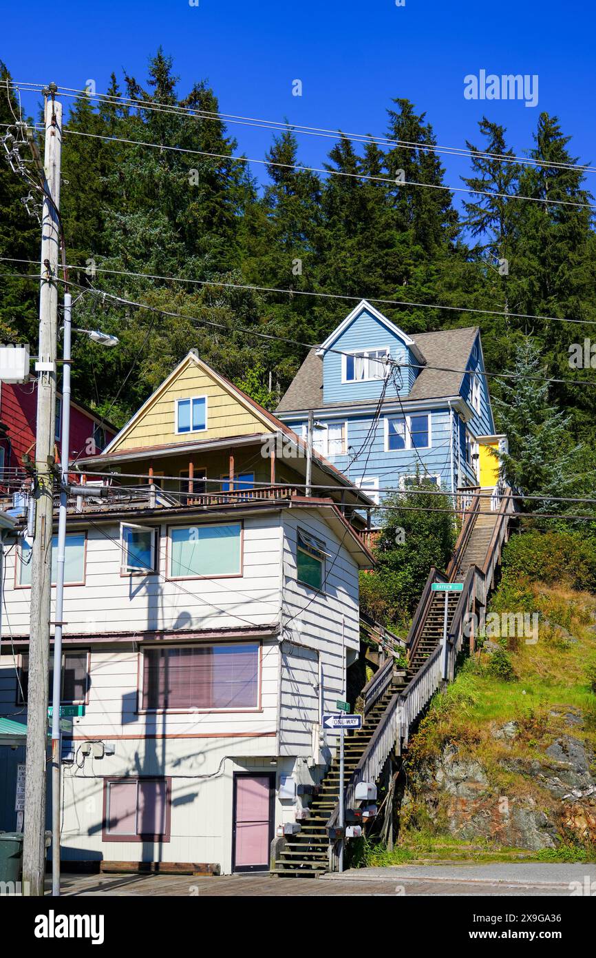 Wooden houses built on a hillside only accessible by steep stairs in ...