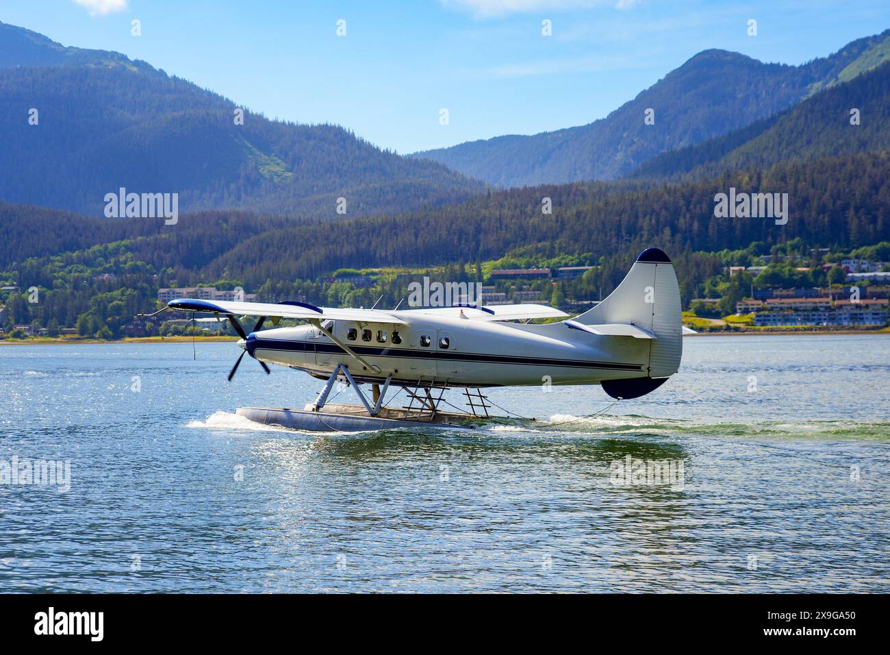 Seaplane landing in the waters of the Gastineau Channel in Juneau, the ...