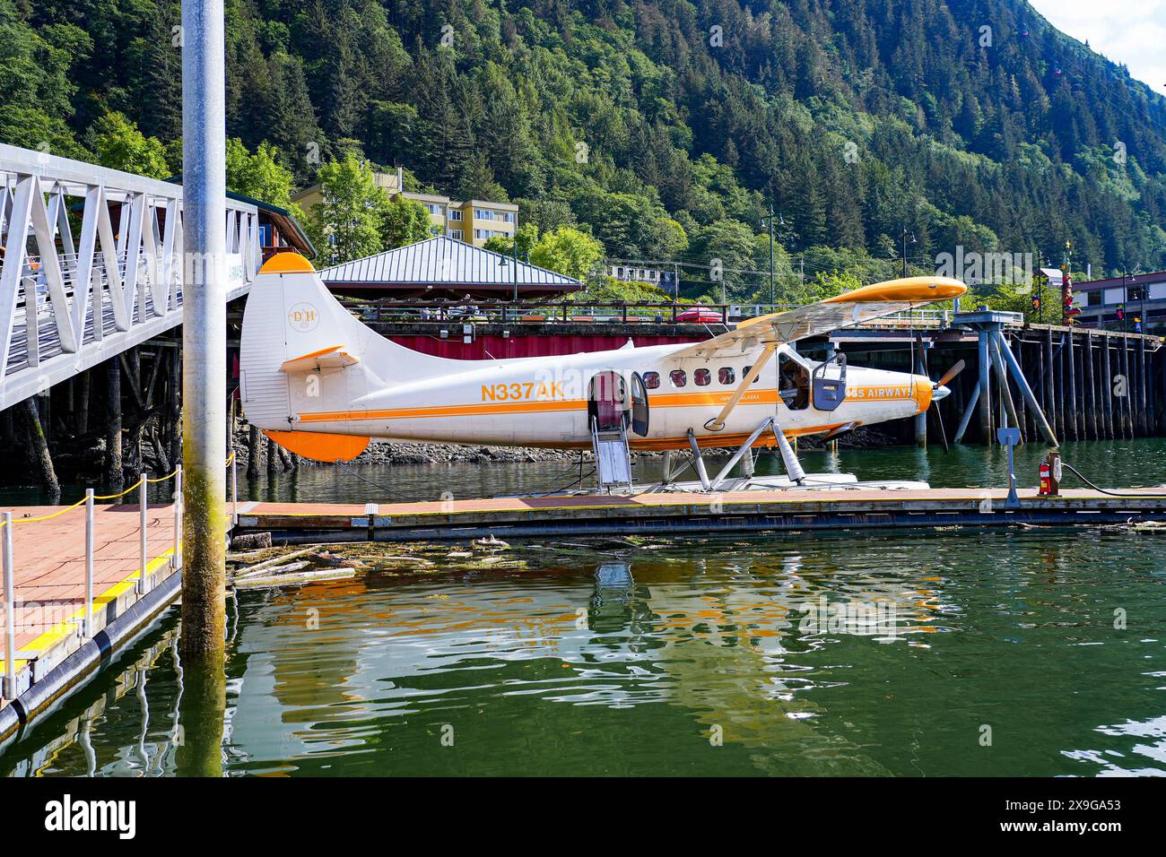 Seaplane moored in the waters of the Gastineau Channel in downtown ...