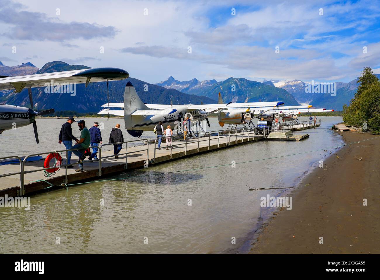 Seaplanes docked in a lake facing the Taku Glacier in the Juneau ...