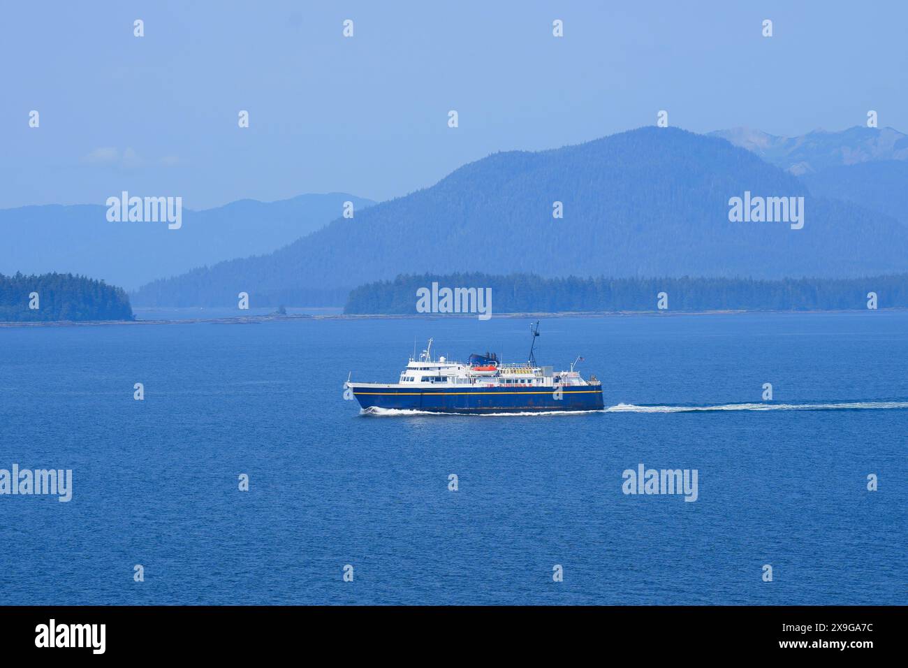 Ferry boat navigating the fjords of the Inside Passage of Southeastern ...