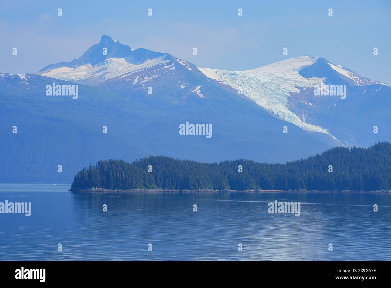 Hanging glacier towering above the coastal waters of the Inside Passage ...