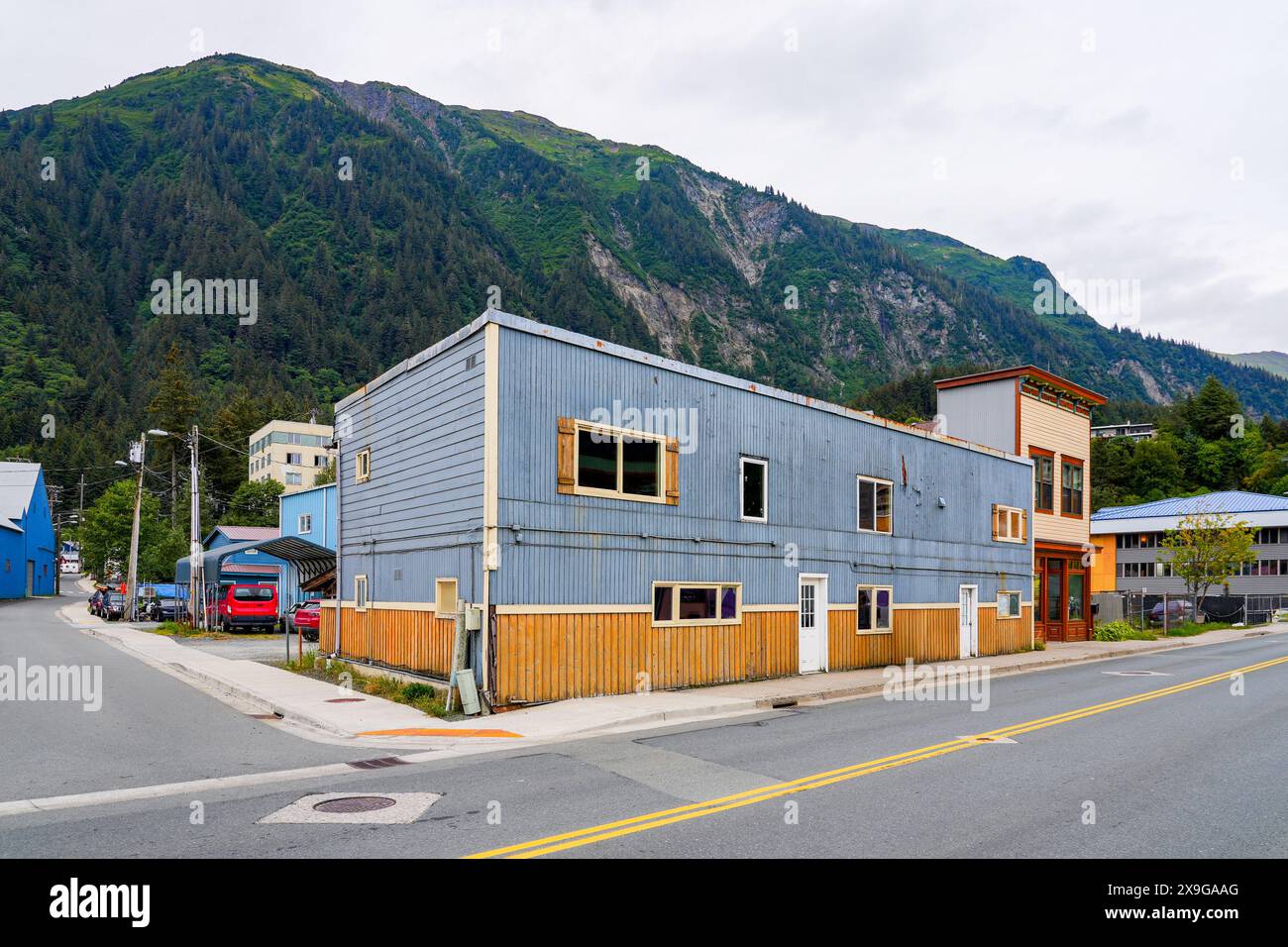 Vintage building covered with blue wooden boards in downtown Juneau ...
