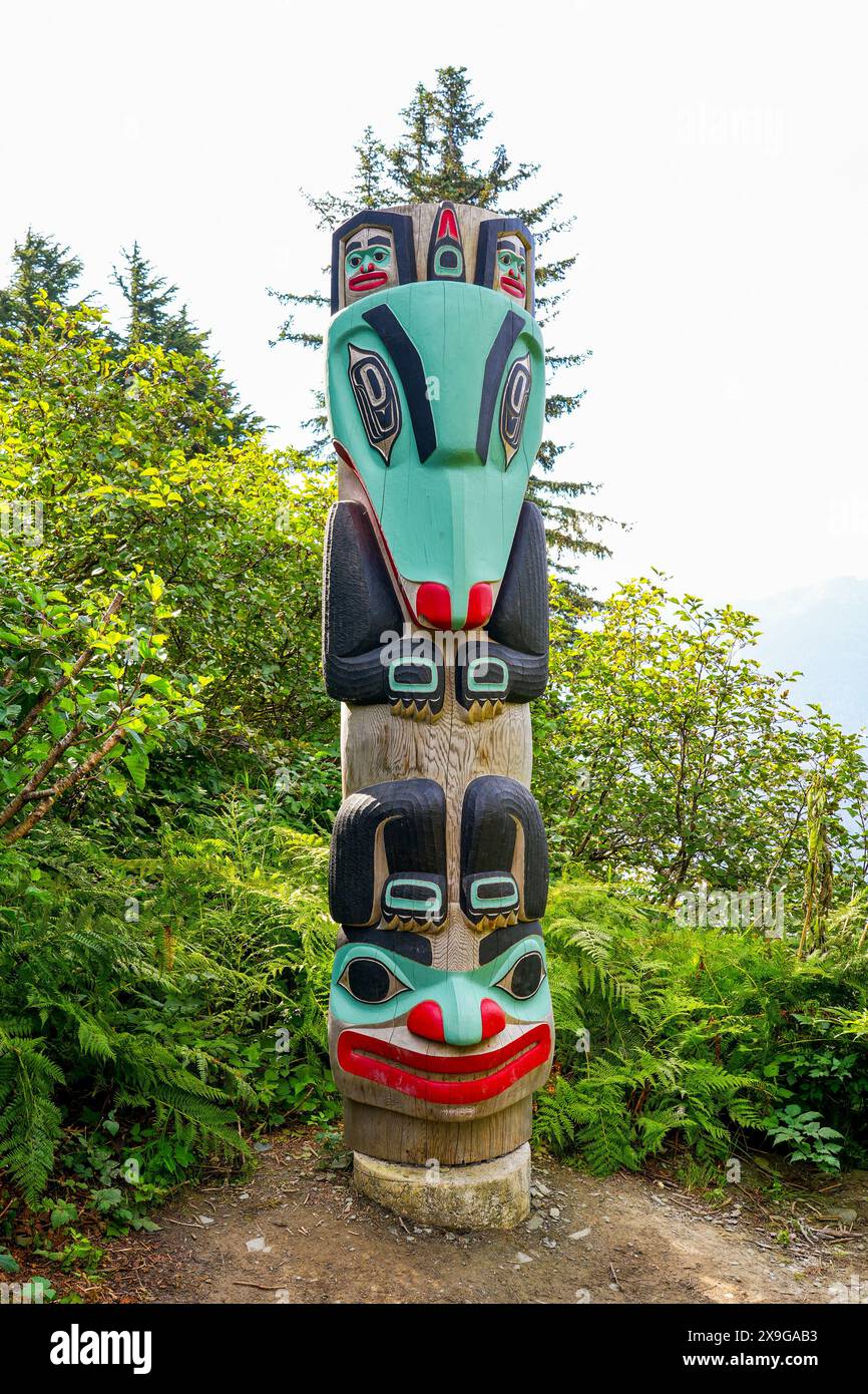 Native American totem pole in a forest on top of Mount Roberts above ...