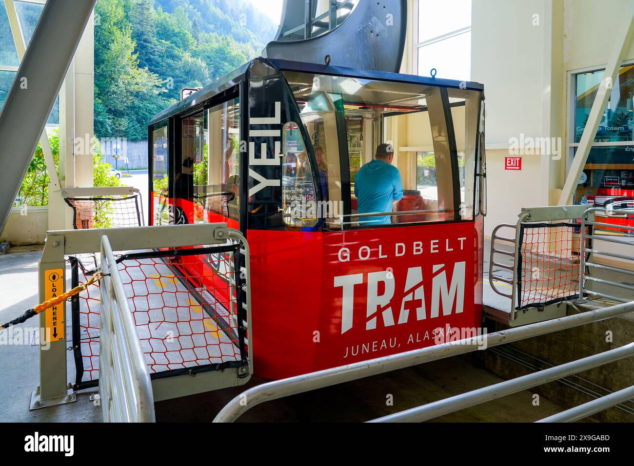 Red gondola of the Goldbelt Tram cable-car at the lower station located ...