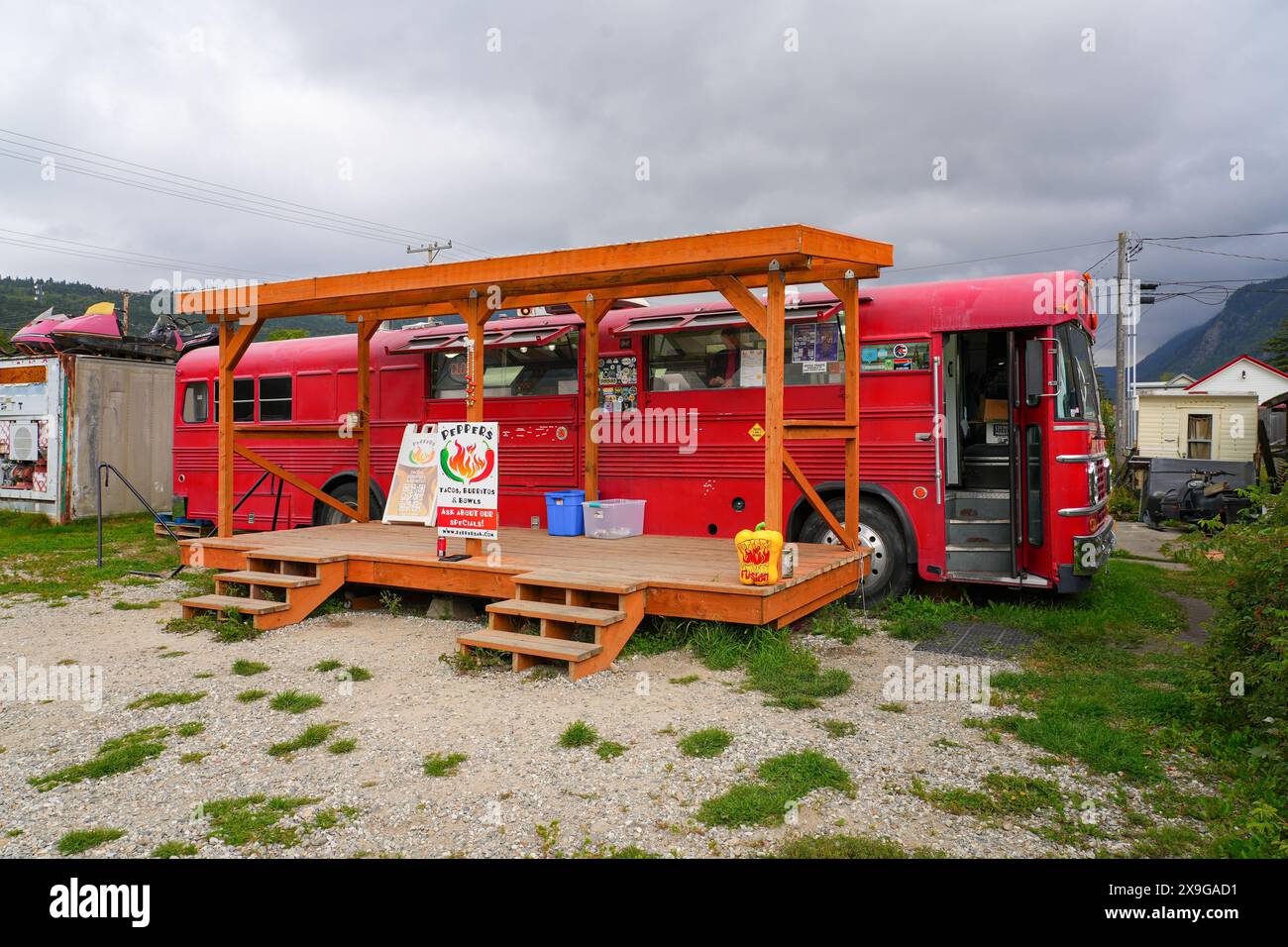 Red bus housing a Mexican restaurant in the old city center of Skagway ...