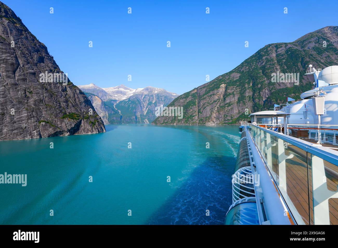 Cruise ship navigating in the narrow Tracy Arm Fjord near Juneau in ...