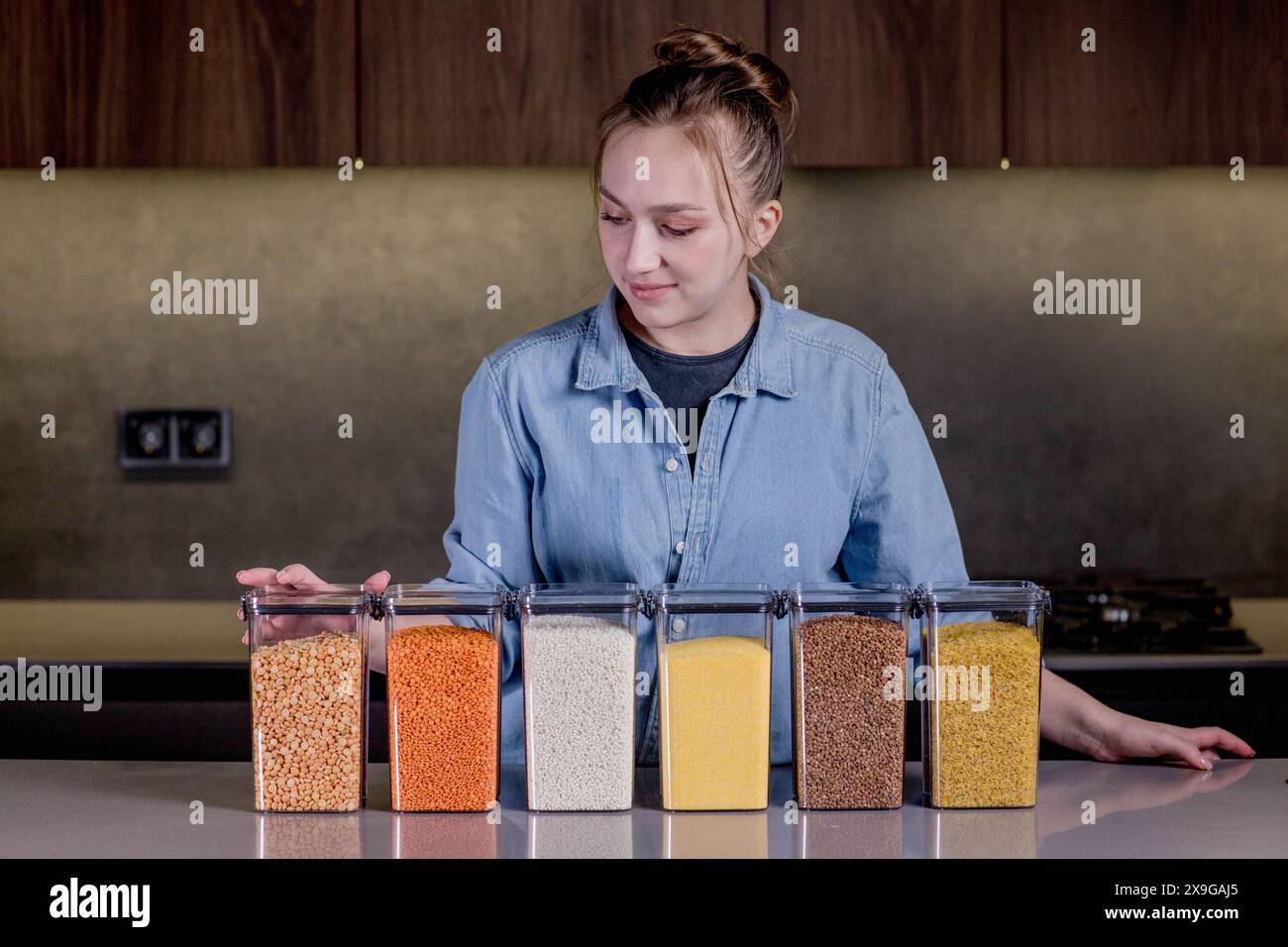 Layout and sorting of food products. Woman uses containers to organize ...