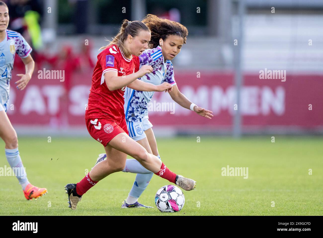 Denmark's Emma Snerle in battle with Spain's Vicky Lopez during the ...