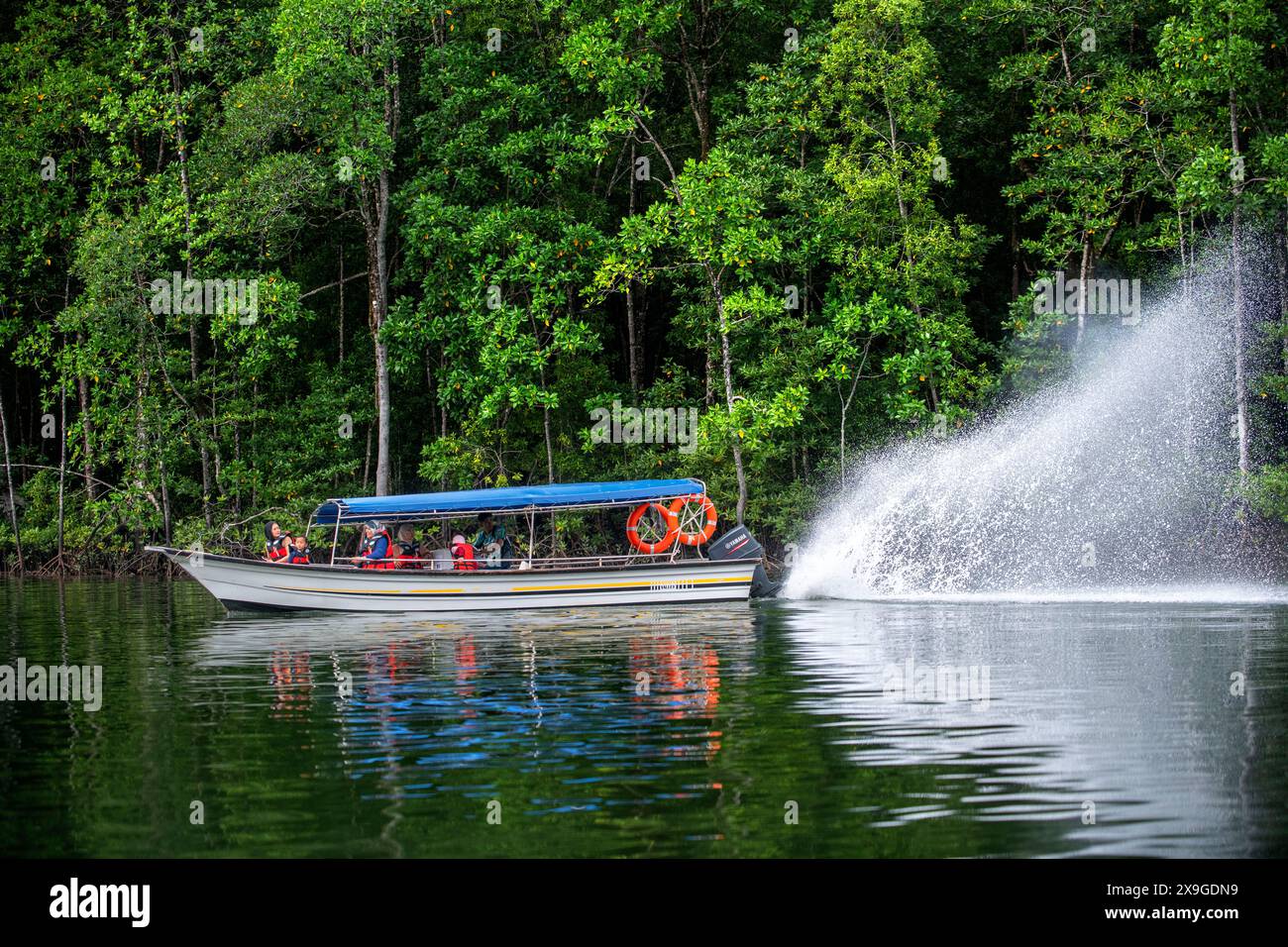 Boat trip at the Kilim Geoforest Park Jetty. Tourist boat starts their ...
