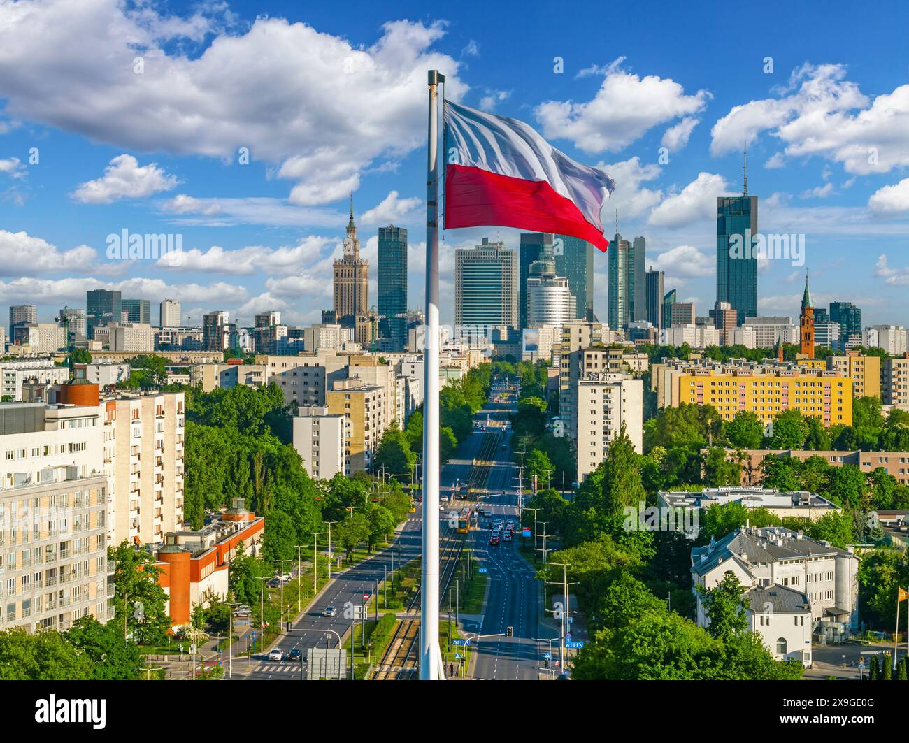 Polish national white and red flag against skyscrapers in Warsaw city ...