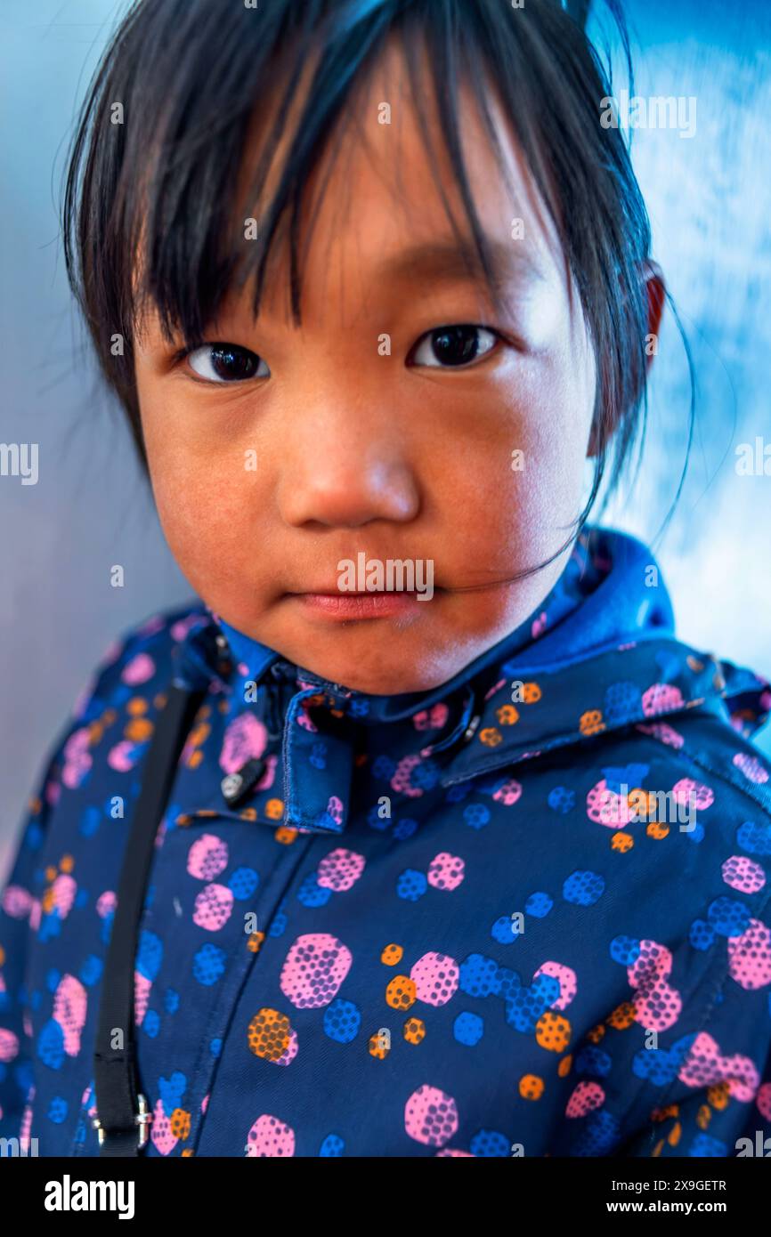Local people, girl in the small isolated inuit village of Aappilattoq ...