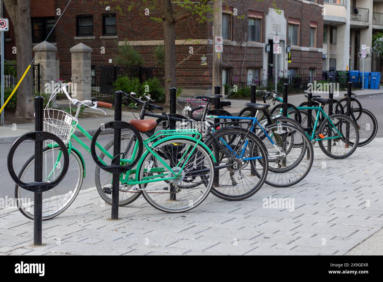 Ottawa, Canada - May 16, 2024: Bikes parked in the city street. Bicycle ...
