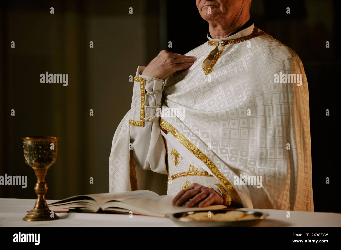 Table of eucharist catholic priest hi-res stock photography and images ...