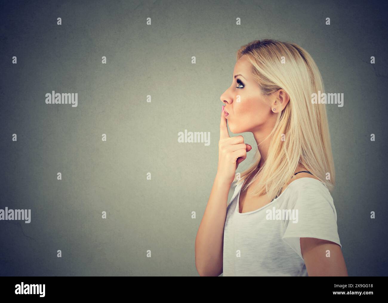 portrait of a thinking looking up woman Stock Photo - Alamy