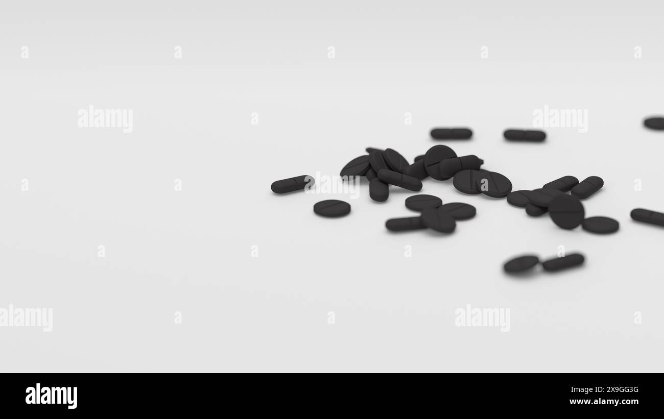 Black tablets on white background with shallow DOF. Drugs, pills ...