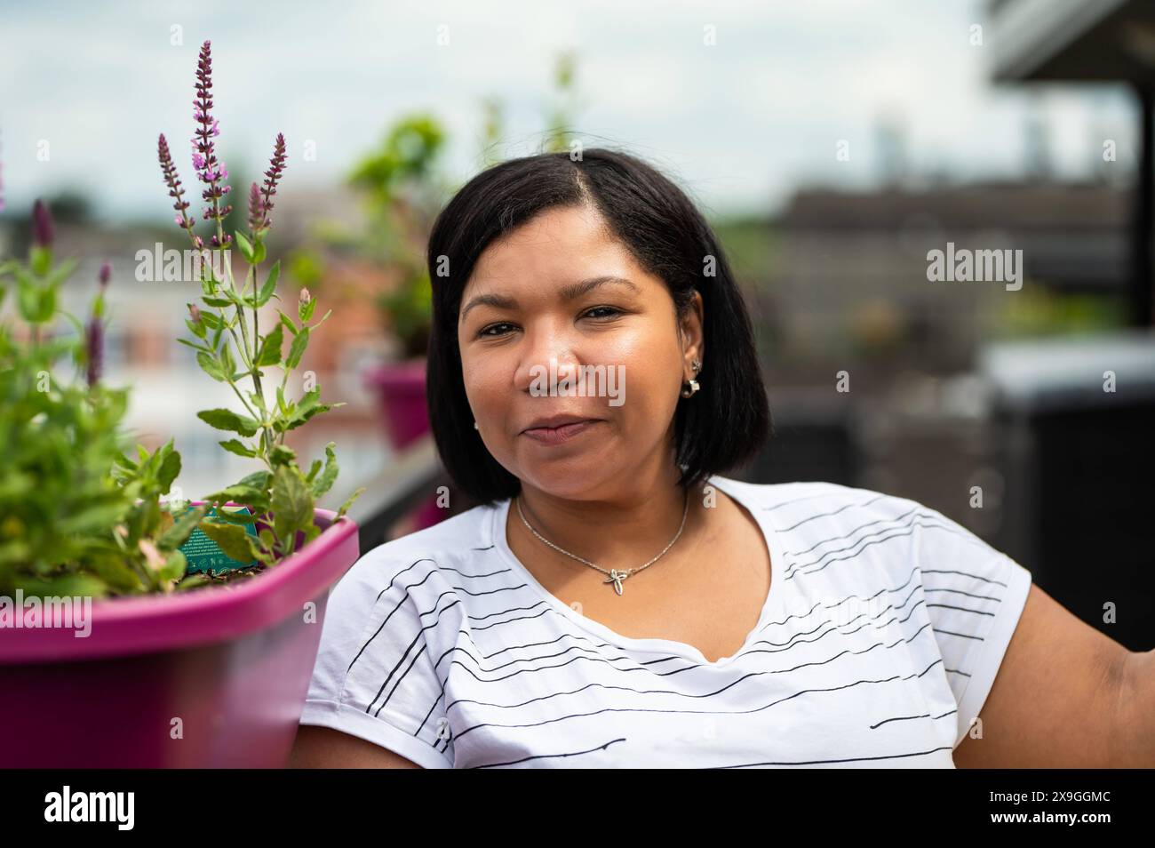 Portrait of a 39 yo hispanic woman on a terrace home, Jette, Brussels ...