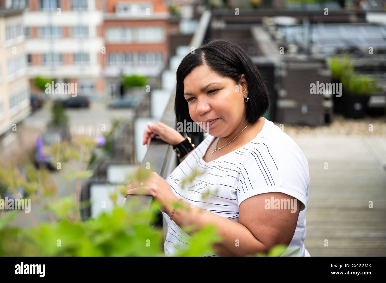 Portrait of a 39 yo hispanic woman on a terrace home, Jette, Brussels ...