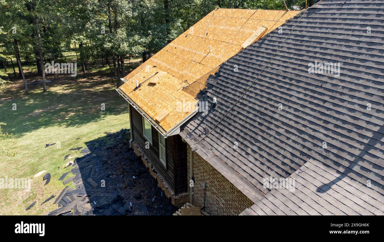 House with new roof being installed after hail damage Stock Photo - Alamy