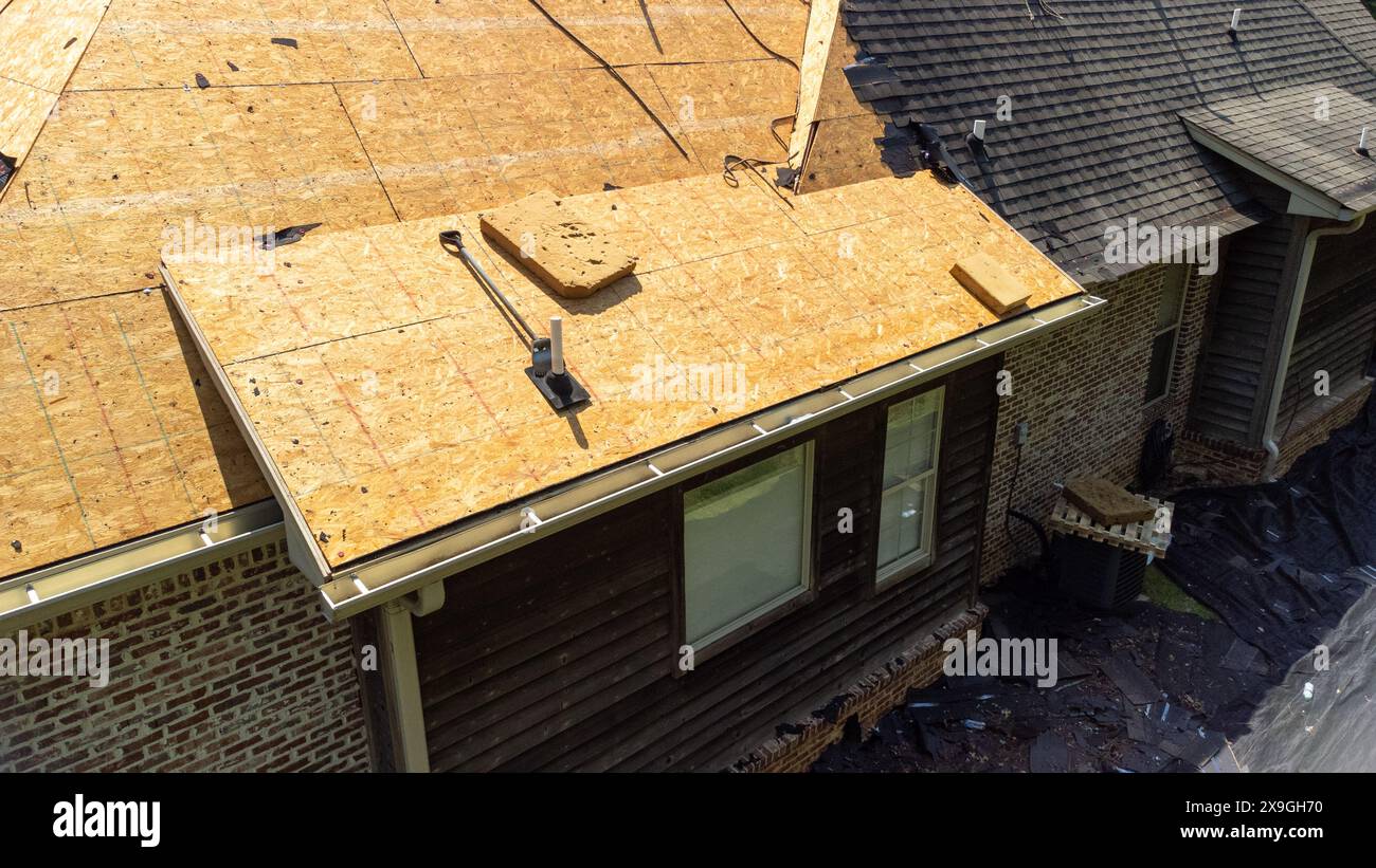 House with new roof being installed after hail damage Stock Photo - Alamy