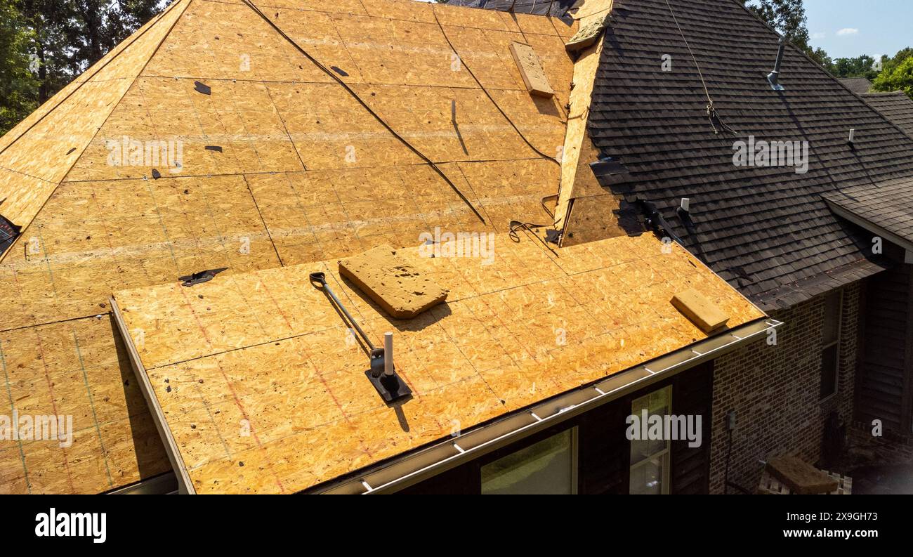 House with new roof being installed after hail damage Stock Photo - Alamy