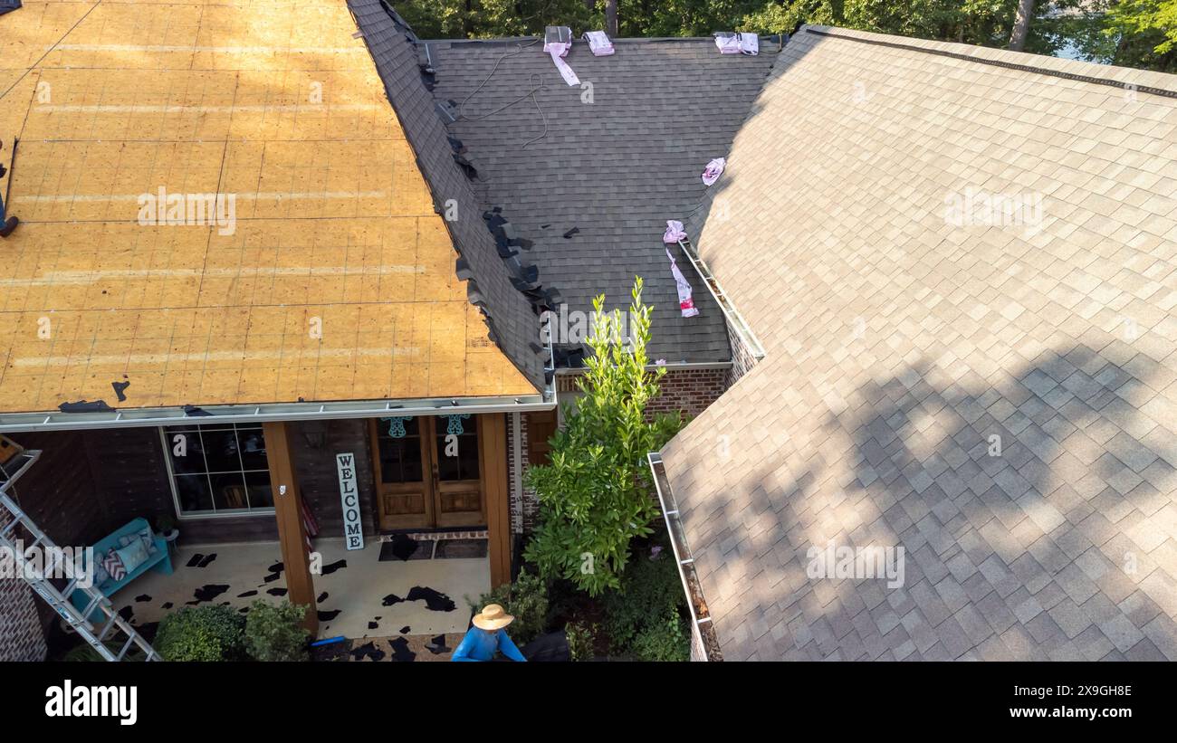 House with new roof being installed after hail damage Stock Photo - Alamy