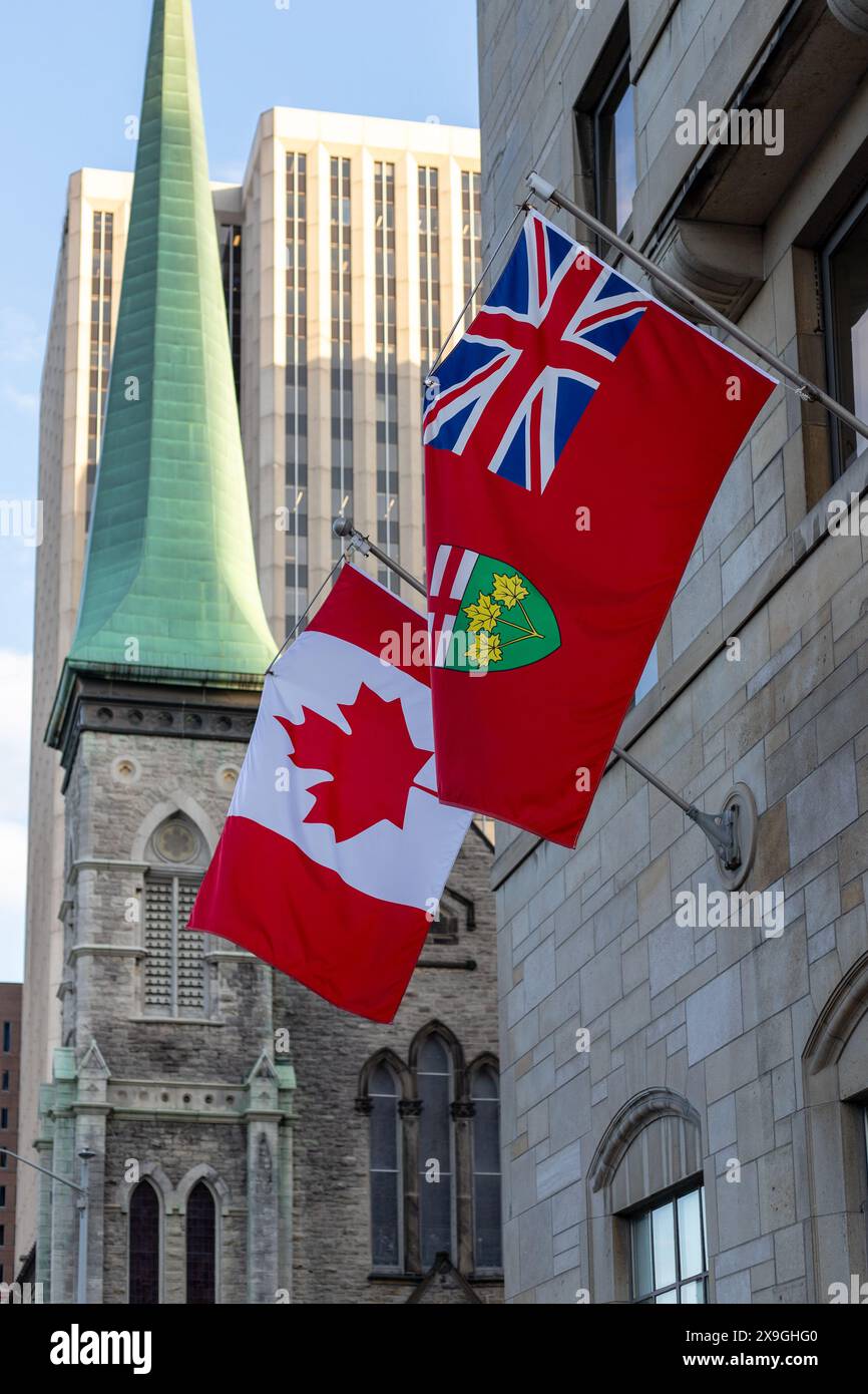 Ottawa, Canada - May 16, 2024: Canadian and Ontario flags on the wall of Lord Elgin hotel ...