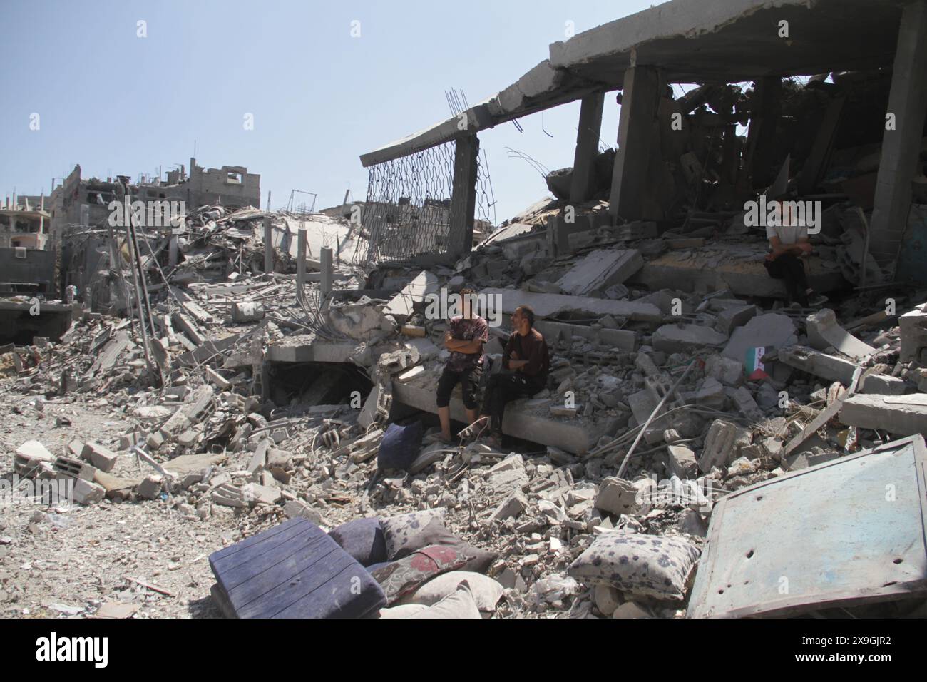 gaza-31st-may-2024-palestinians-sit-among-the-rubble-after-israeli