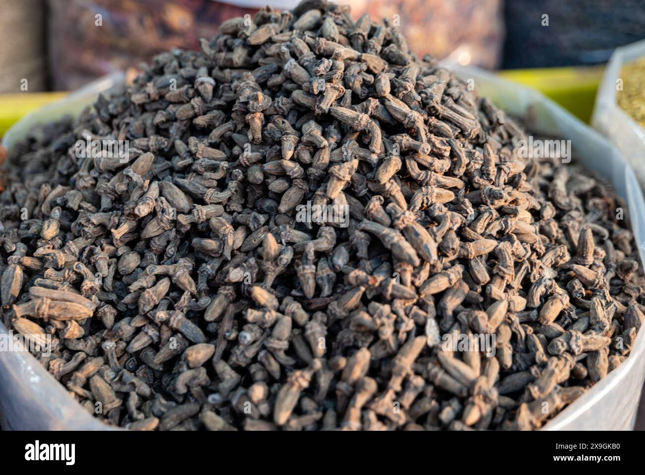 A close-up of dried herbal pods, rich in texture, displayed at a ...