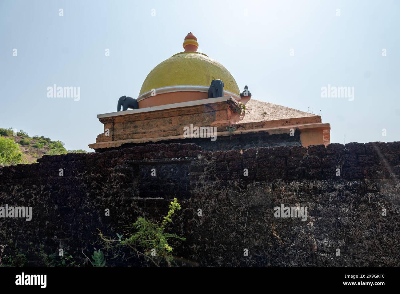 Captivating view of Ram Temple’s vibrant yellow dome atop dark stone ...