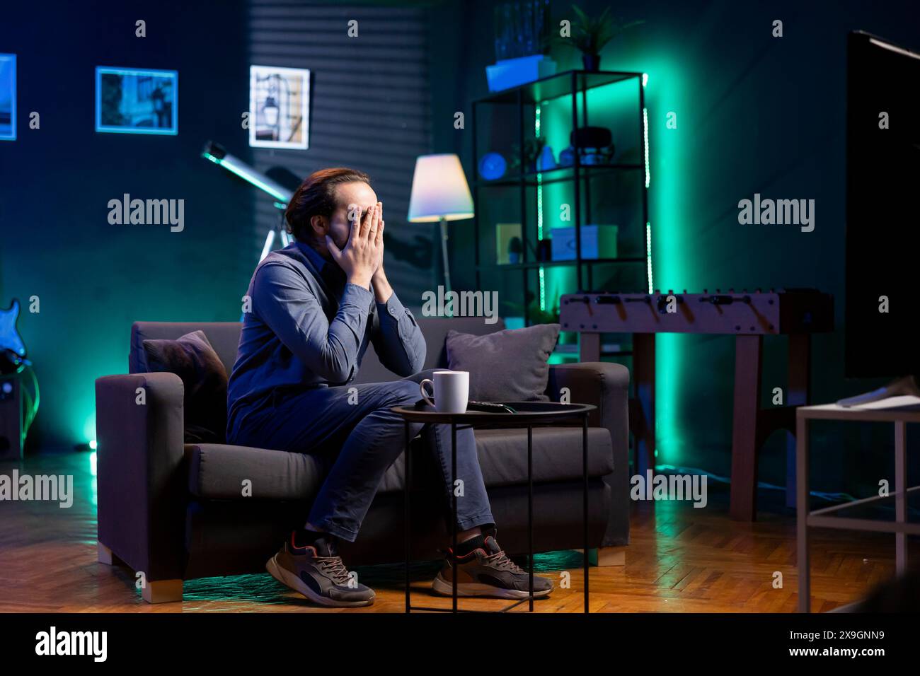 Man watching thriller slasher movie broadcasted on TV, concerned by ...