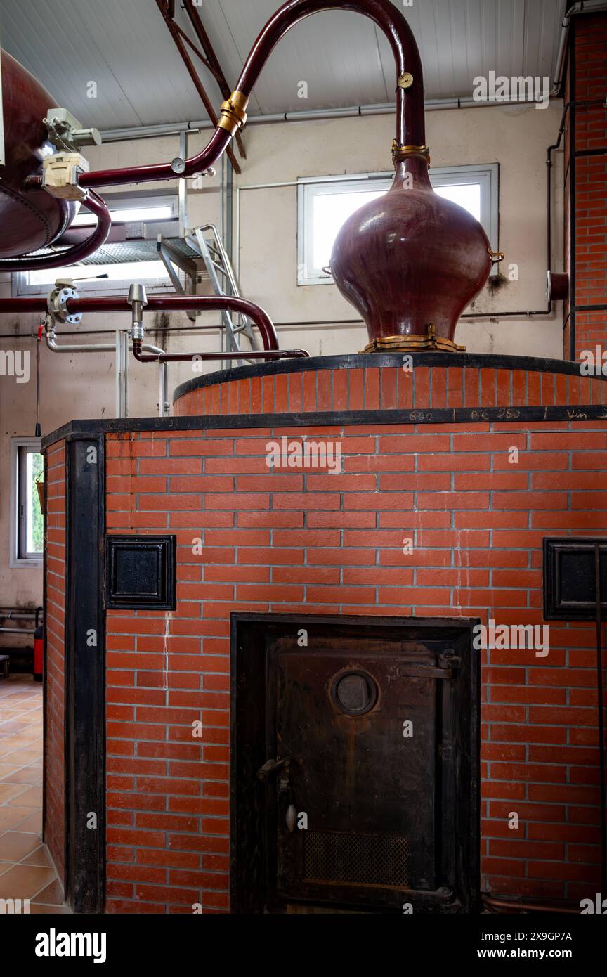 Double distillation process of cognac spirits in Charentias copper ...