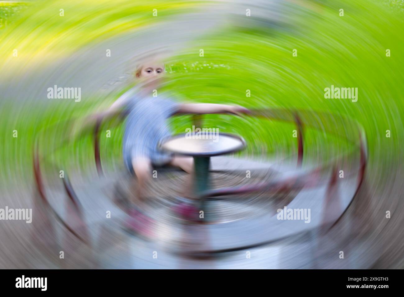 dizziness and balance, preschool girl, child spinning on carousel on ...
