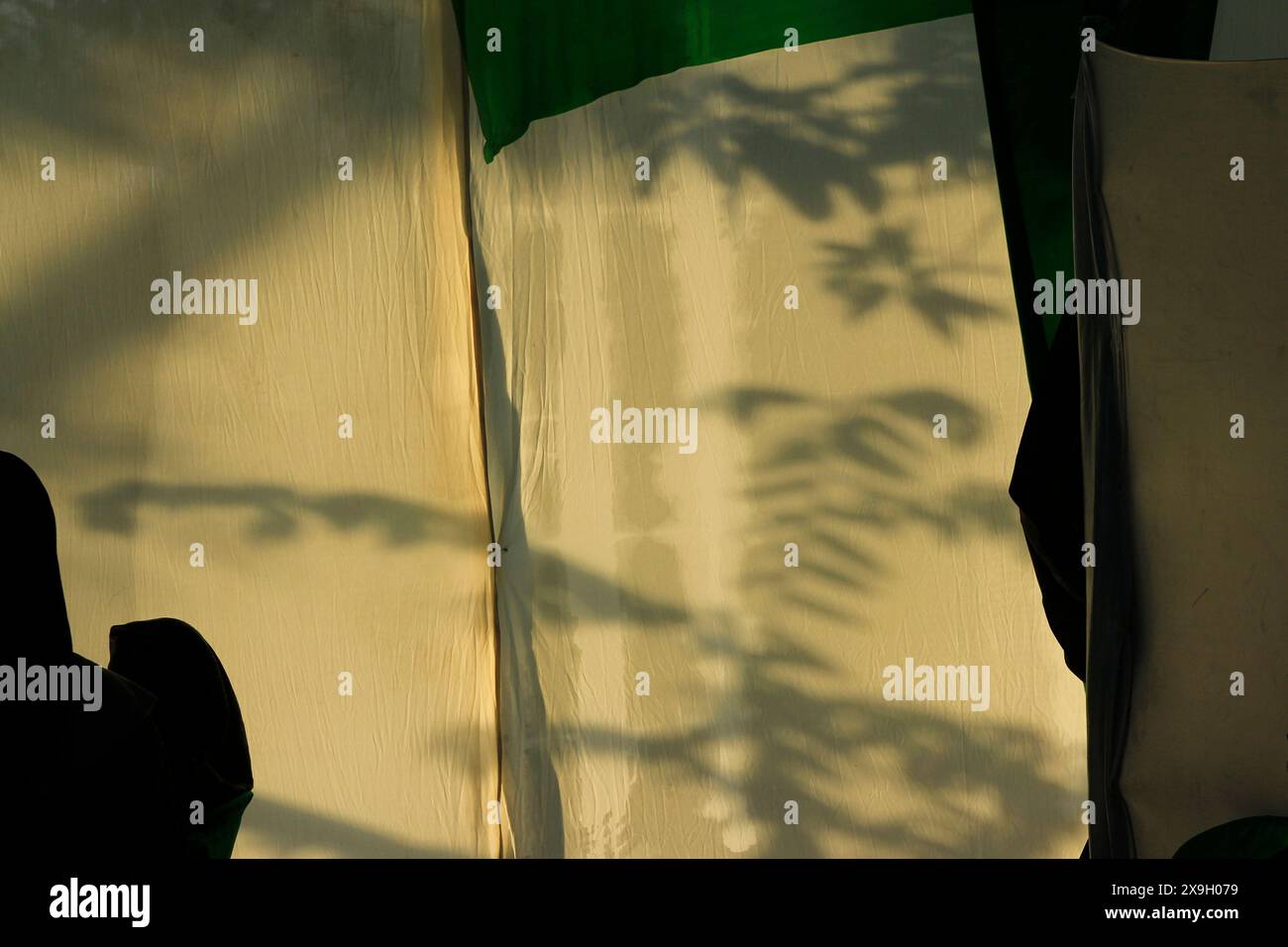 Abstract background on stretched fabric with morning sun lighting from ...