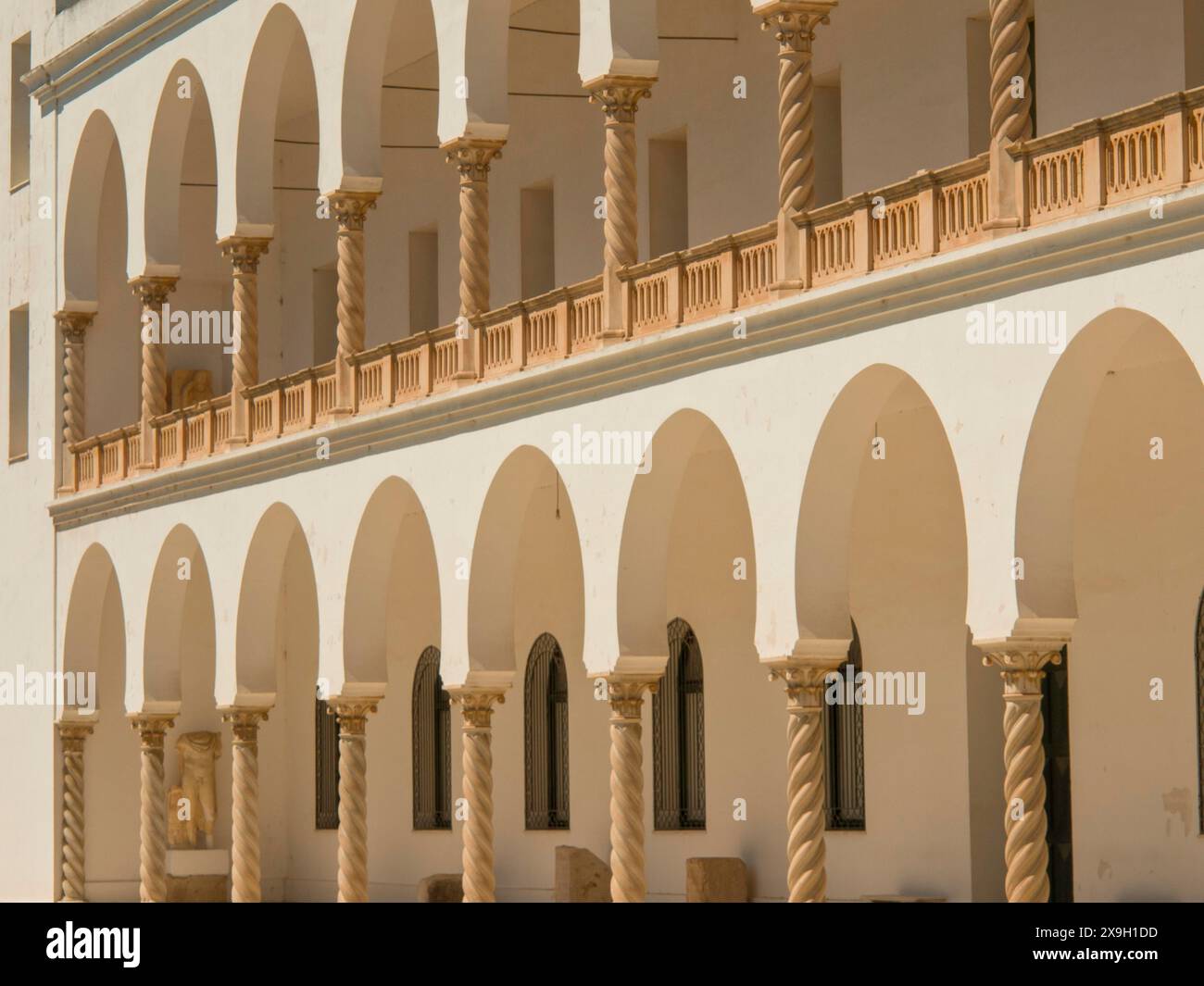 Historic building with sandstone arches and colonnades, Tunis in Africa ...
