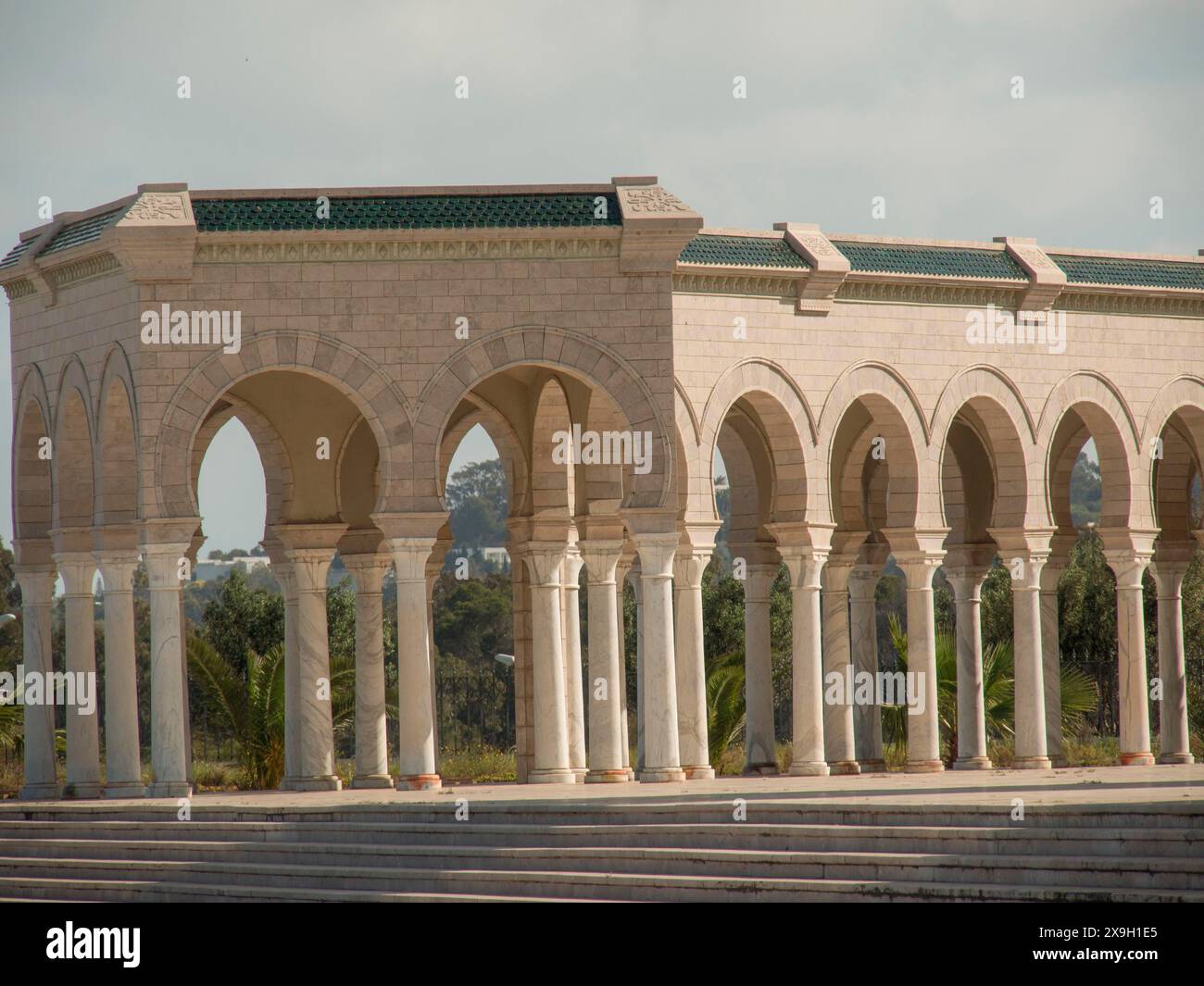 Sandstone arcades with arches and columns in open daylight, Tunis in ...