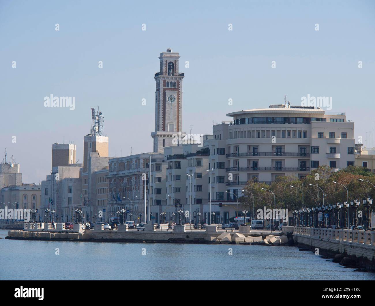 Urban landscape along the water with several buildings and harbour ...