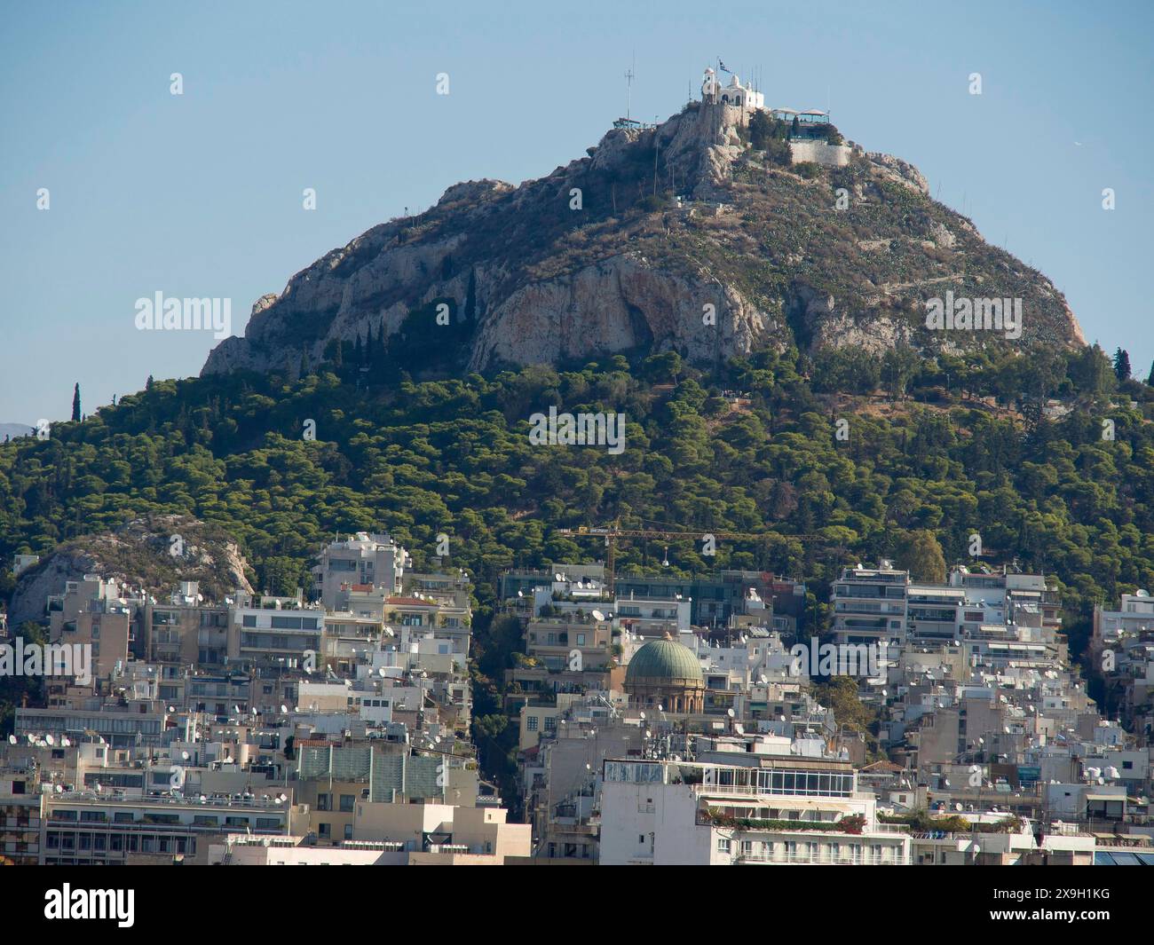 Mountain view with buildings in the foreground, surrounded by nature ...