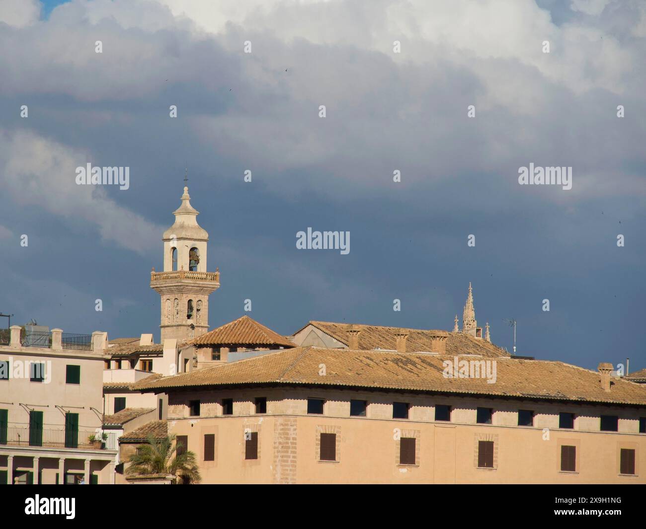 City view with church tower and clouds in the sky, palma de Majorca on ...