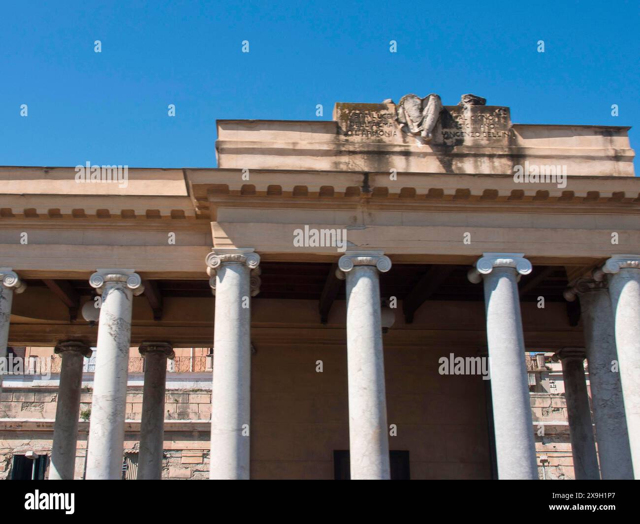 Ancient temple with columns and architraves under a clear blue sky ...