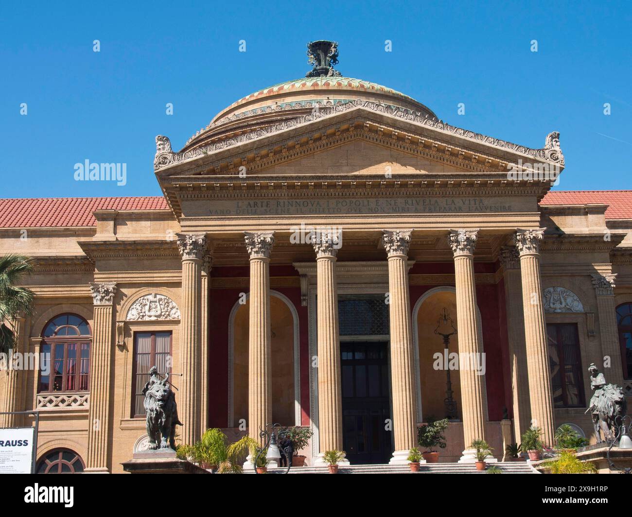 Historic theatre building with imposing columns and richly decorated ...