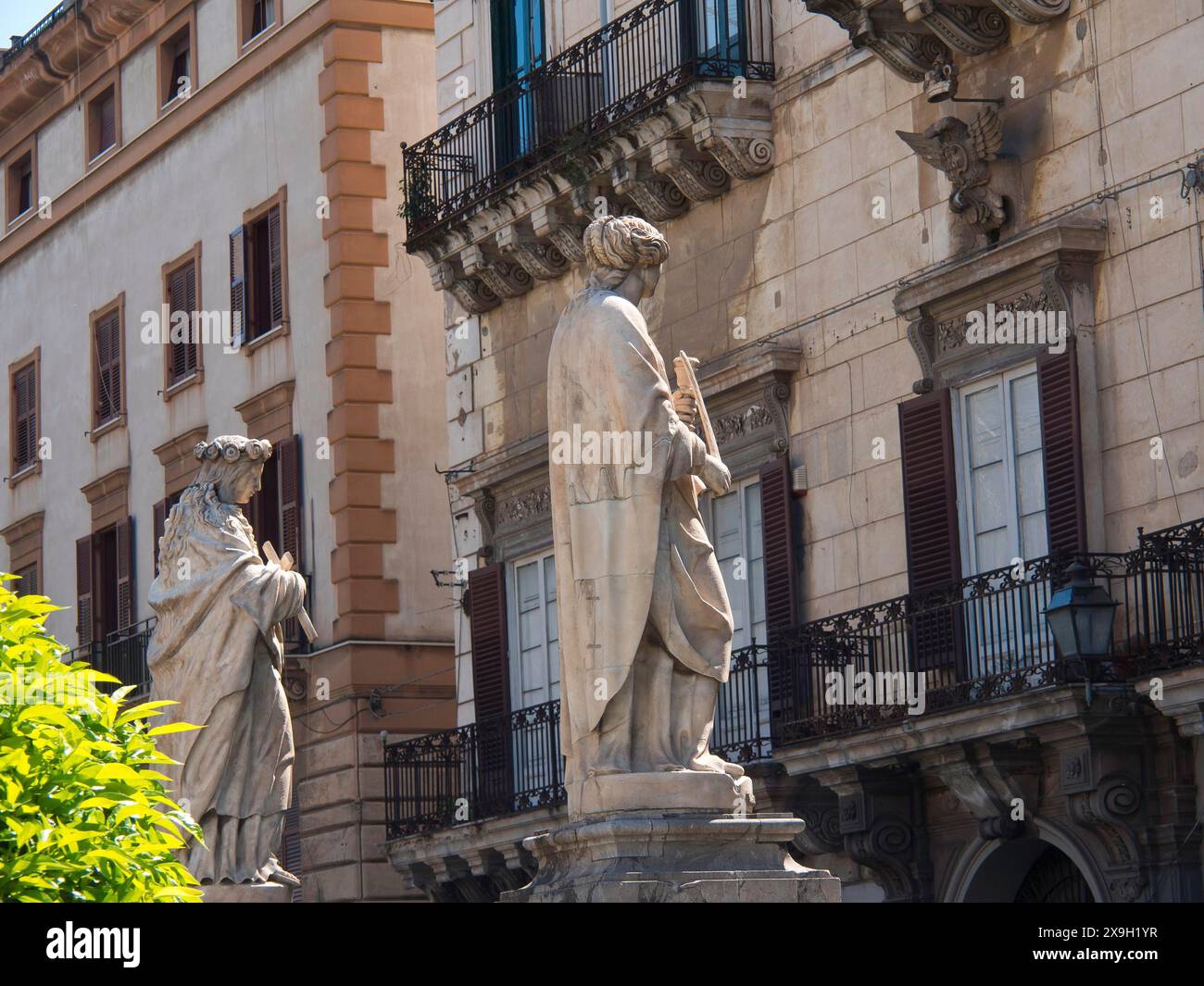Historic buildings with balustrades and sculptures in the city, palermo ...