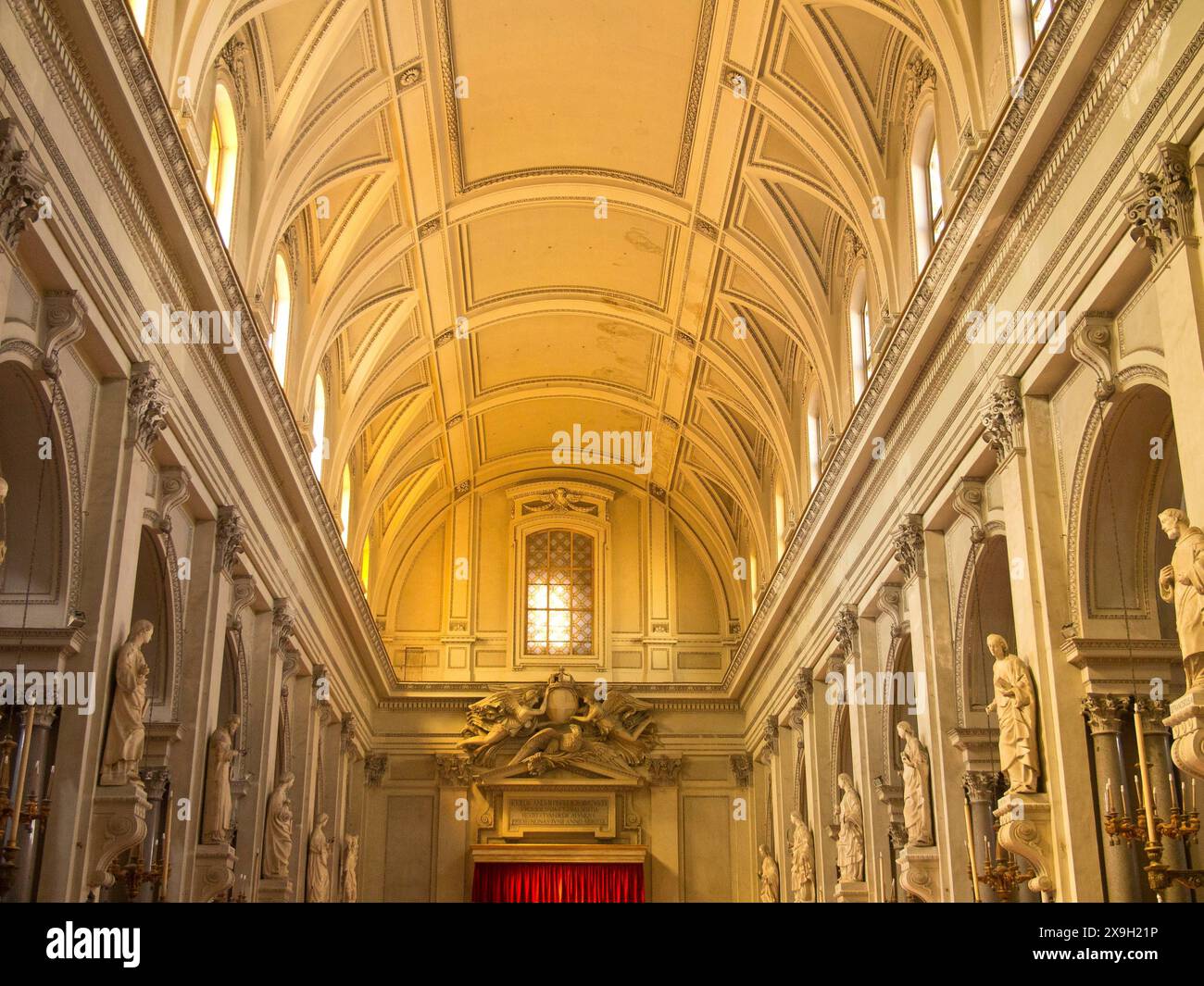 Magnificent interior architecture of a church with statues, arches and ...