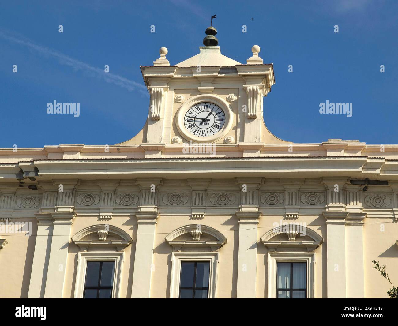Historic clock tower with magnificent facade under a clear blue sky ...